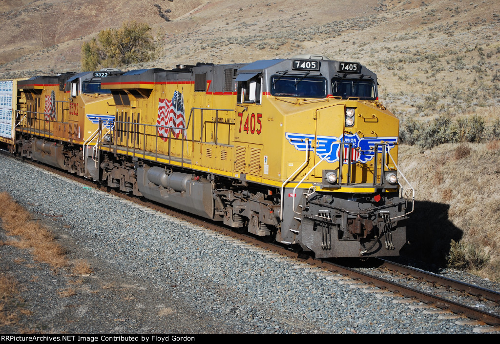 UP 7405 & UP 5322 lead an east bound UP freight down hill